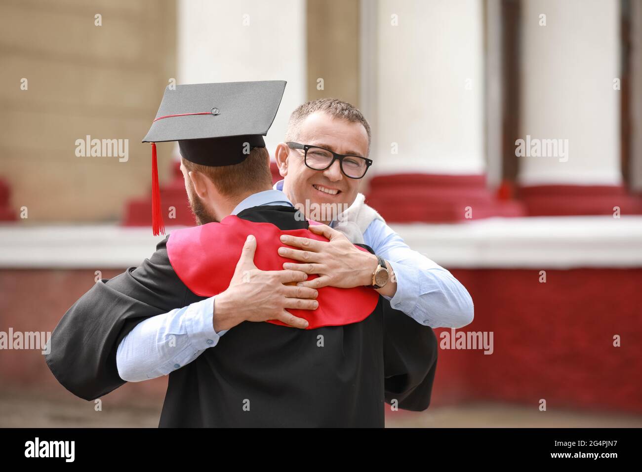 Happy young man with his father on graduation day Stock Photo - Alamy