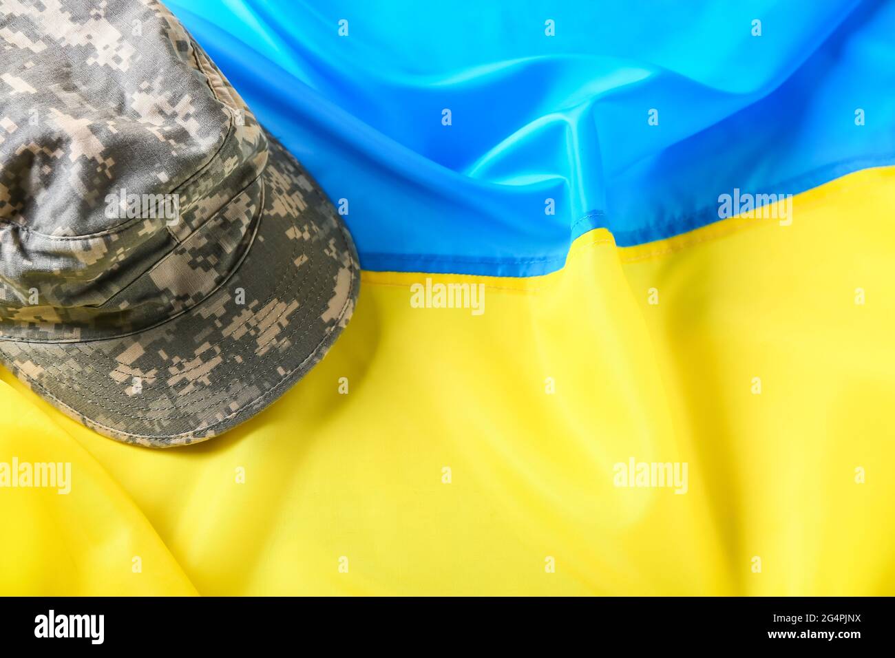 Military cap on flag of Ukraine Stock Photo - Alamy