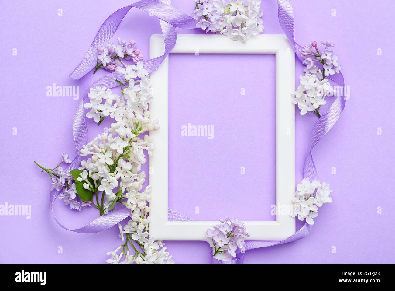 Beautiful lilac flowers and frame on color background Stock Photo - Alamy