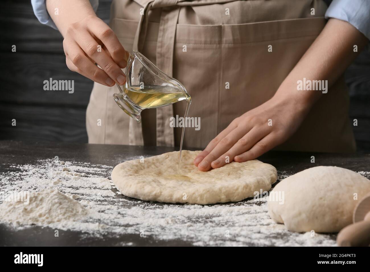 Chef pouring oil hi-res stock photography and images - Alamy