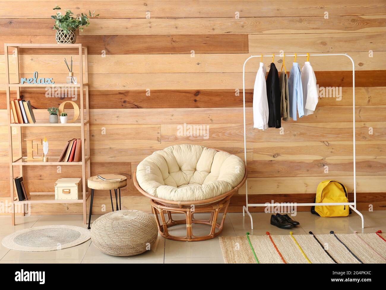 Rack with stylish school uniform in interior of room Stock Photo - Alamy