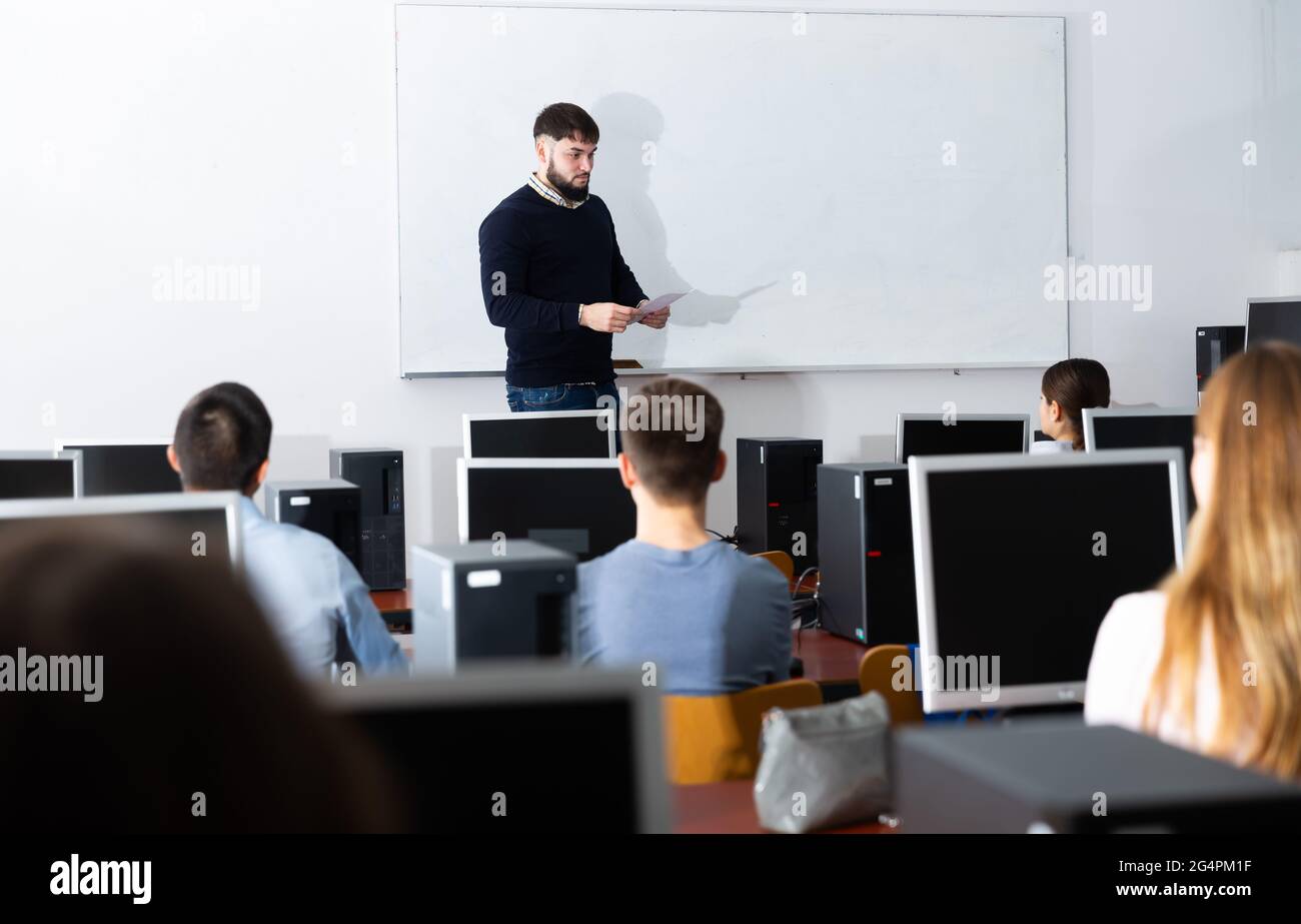 Teacher gives lecture in the classroom Stock Photo - Alamy