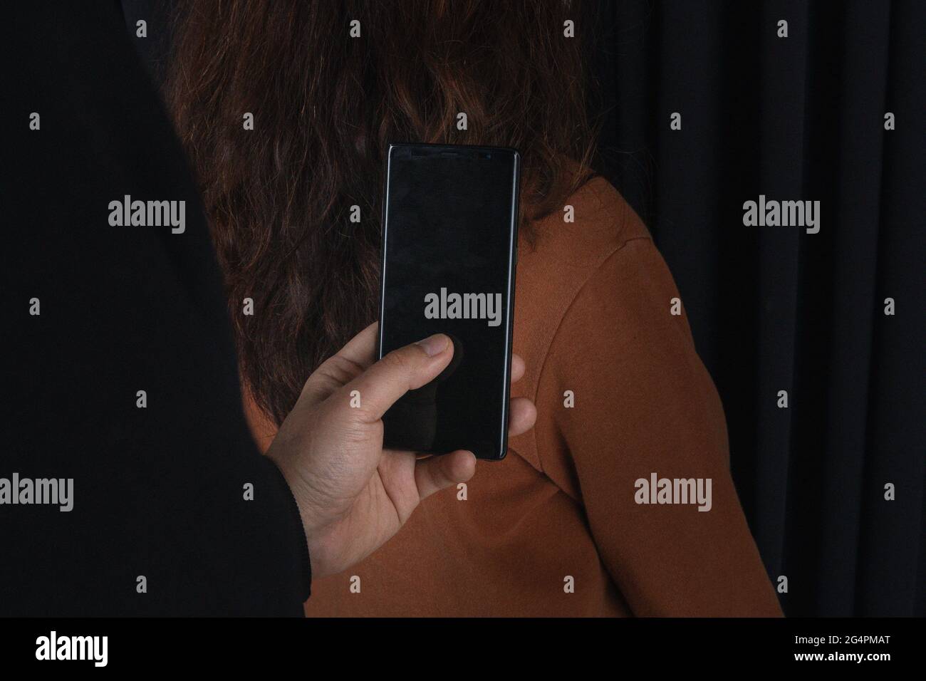 illegal photoshoot crime, criminal taking a photo of person from behind ...