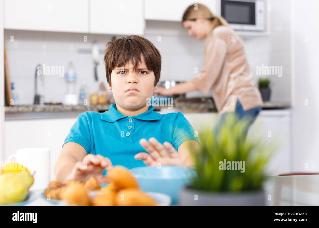 Displeased boy refusing to eat Stock Photo - Alamy