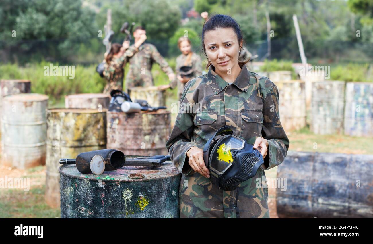Upset girl with after direct hit in paintball game Stock Photo - Alamy