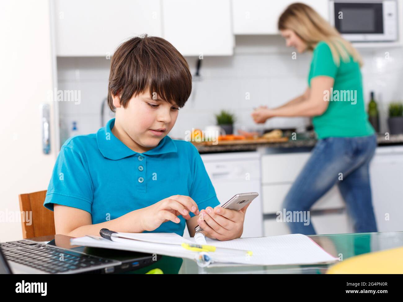Mother schoolboy son doing hi-res stock photography and images - Alamy