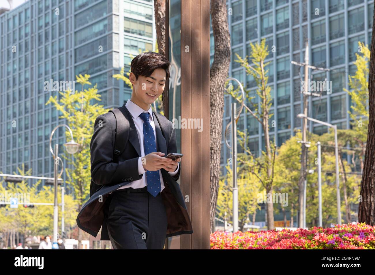 first day of newly recruited Asian man employee in smart casual suit ...