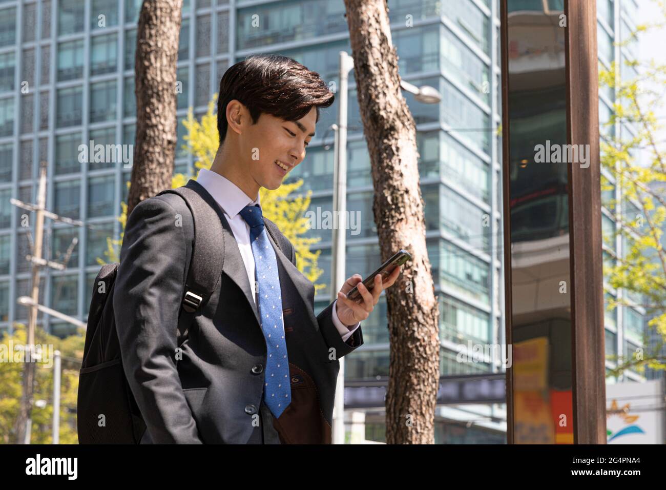 Asian man employee on smartphone in company, business communication ...