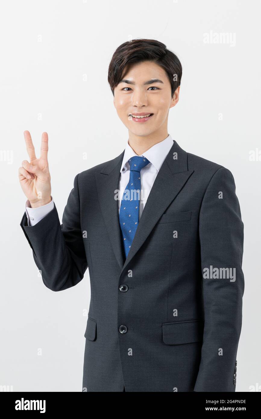 smiling Asian man employee with fingers showing numbers Stock Photo - Alamy