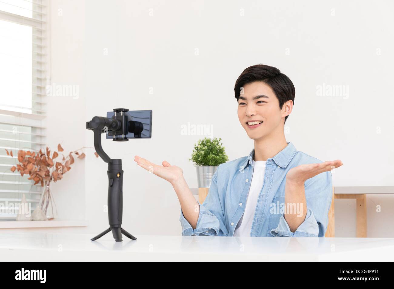 Young asian male content creator hi-res stock photography and images ...