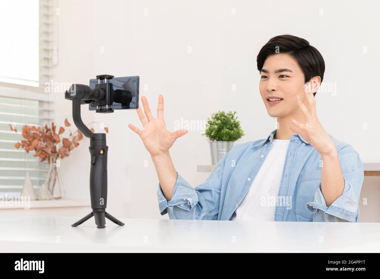 Young asian male content creator hi-res stock photography and images ...