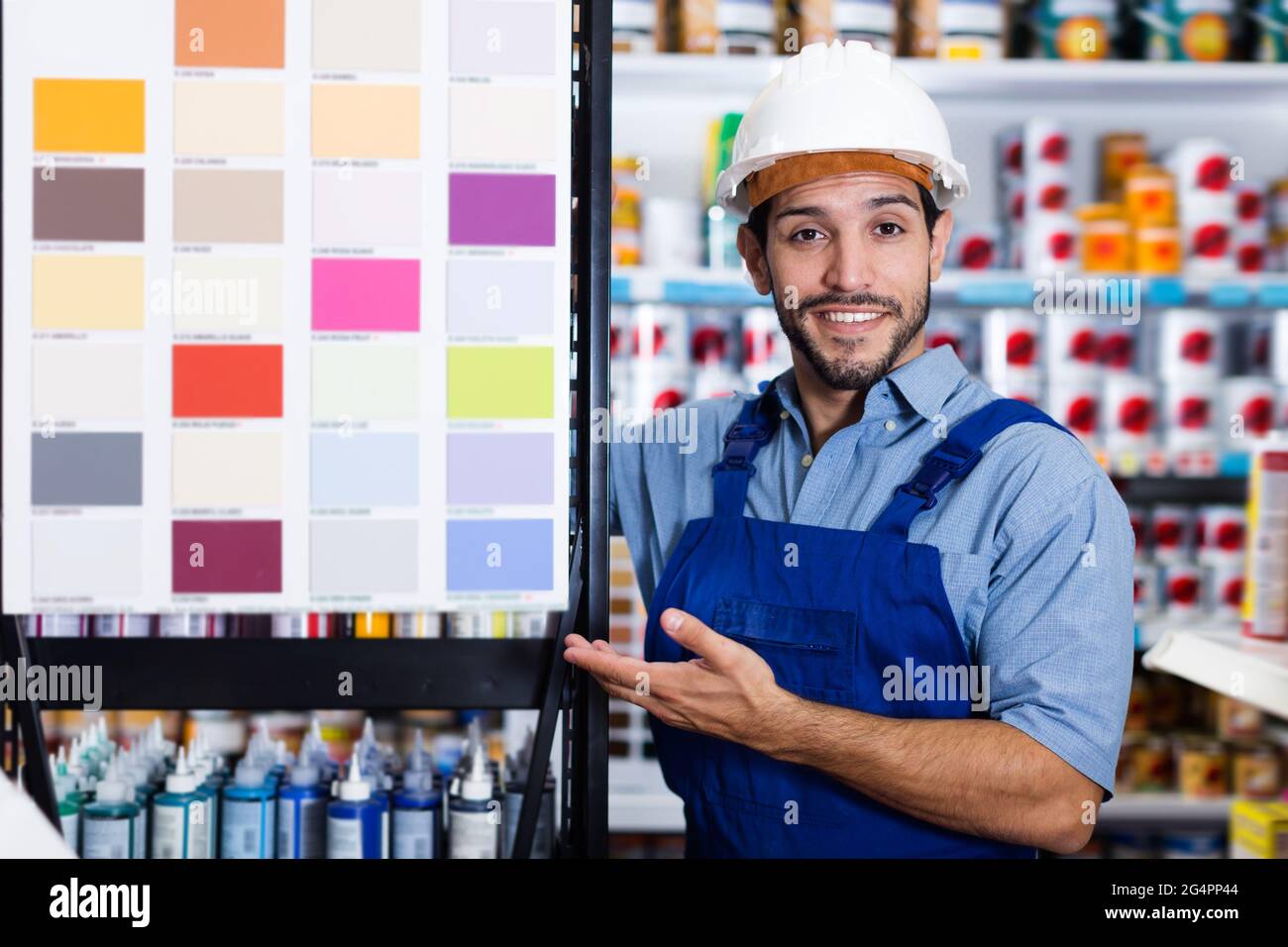 Adult foreman showing samples of paint Stock Photo - Alamy