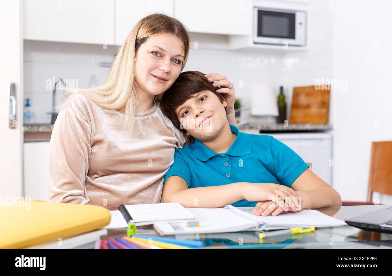Family doing homework at kitchen Stock Photo - Alamy