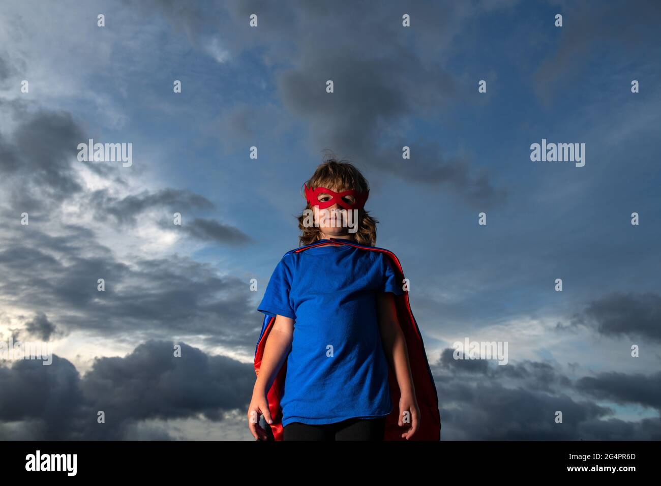 Little child is playing superhero. Boy super hero concept Stock Photo ...