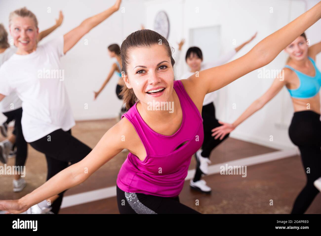 Cheerful different ages women learning swing steps at dance class Stock ...