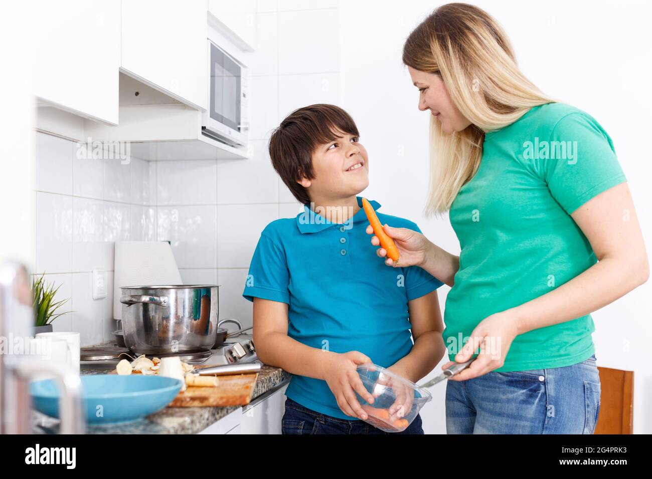 Woman and boy cooking together Stock Photo - Alamy