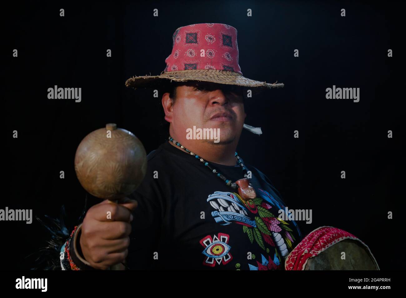 Proud Mexican Shaman holding up his drumstick after successfully ...