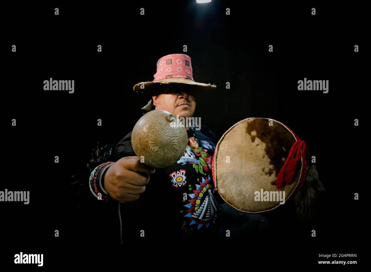 Mexican shaman performing ancient rituals of summoning spirits with ...