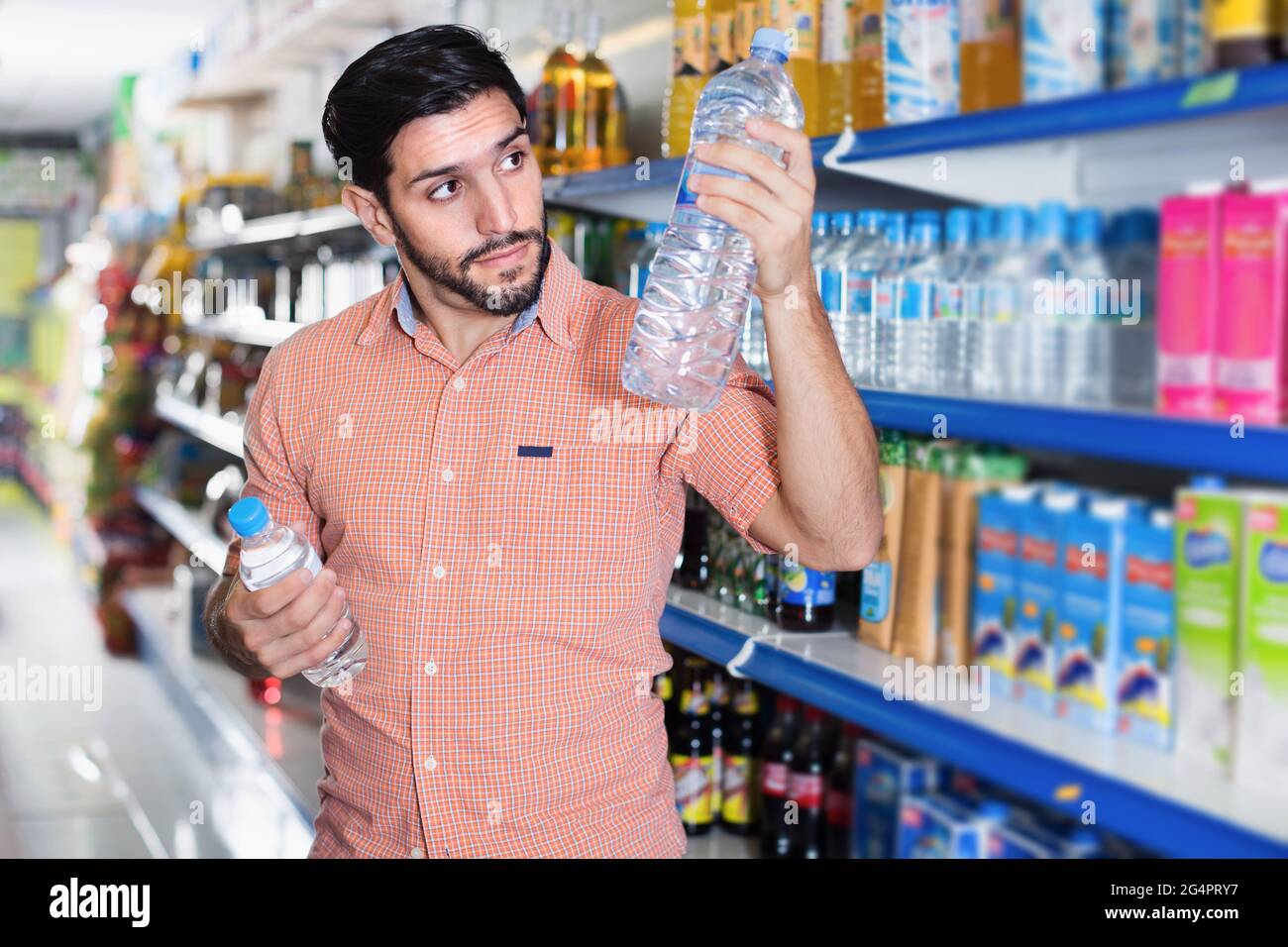Man buying mineral water in hi-res stock photography and images - Alamy