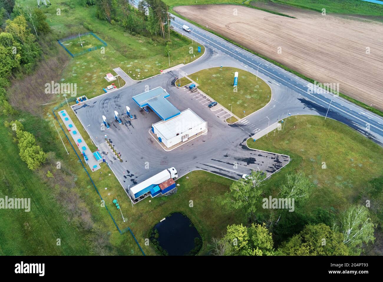 Gas station near highway with moving cars, aerial view Stock Photo - Alamy