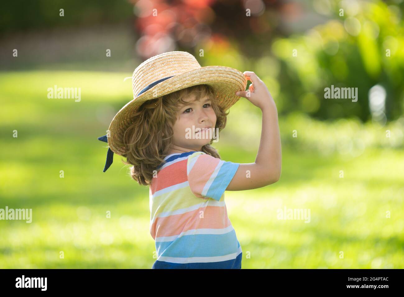 Caucasian child in straw hat. Kids summer face Stock Photo - Alamy
