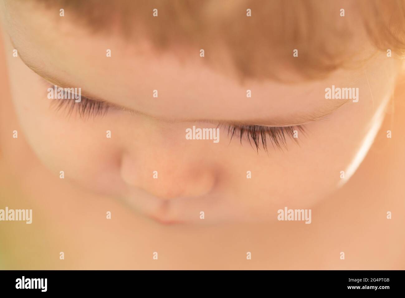 Caucasian baby child portrait close up with long lashes. Kids cropped ...