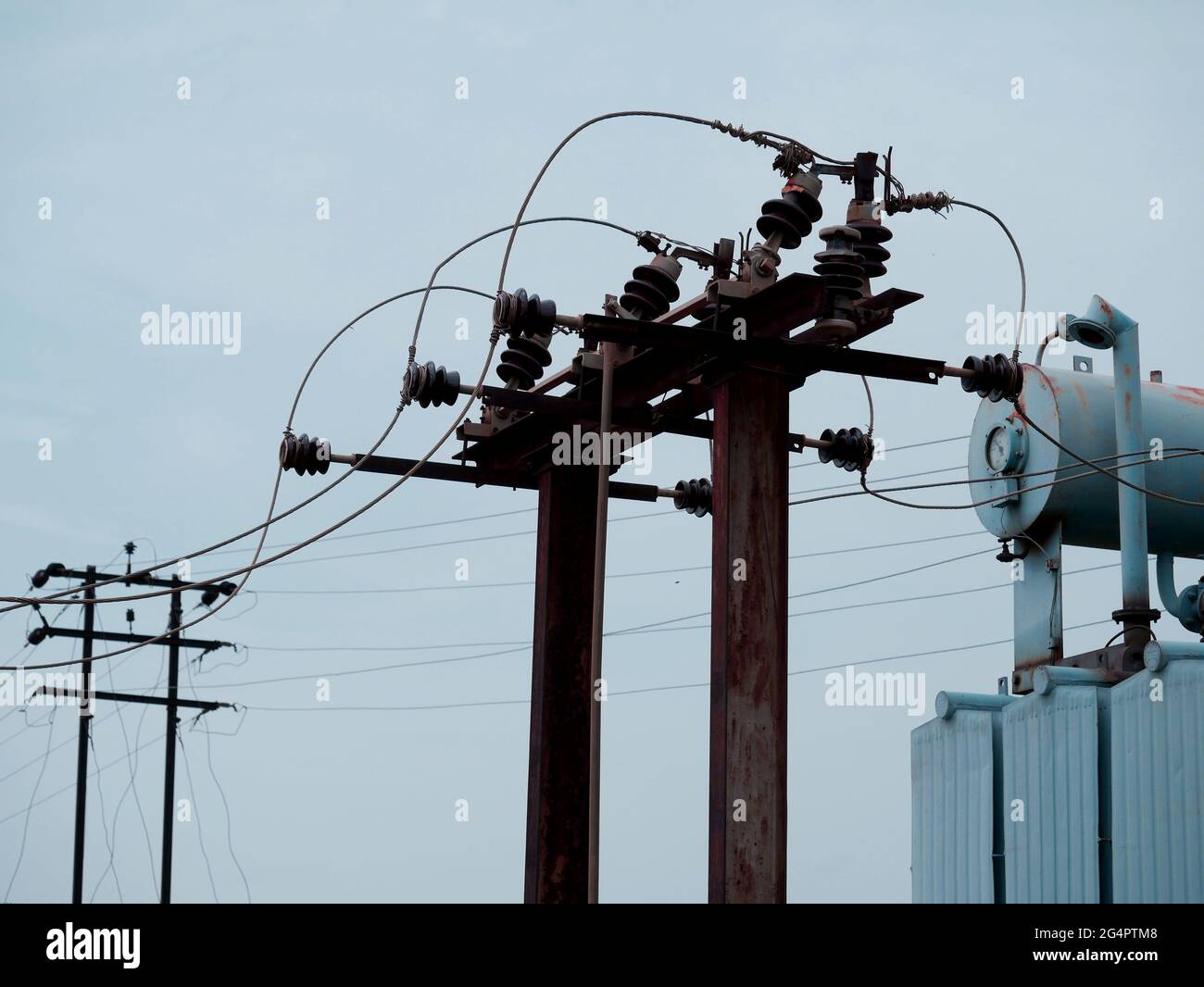 Electric supply transformer pole wire connection on light sky ...