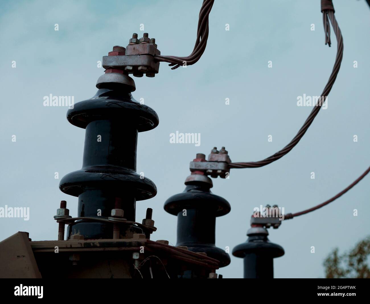Industrial electric supply heavy equipment tower on sky background ...