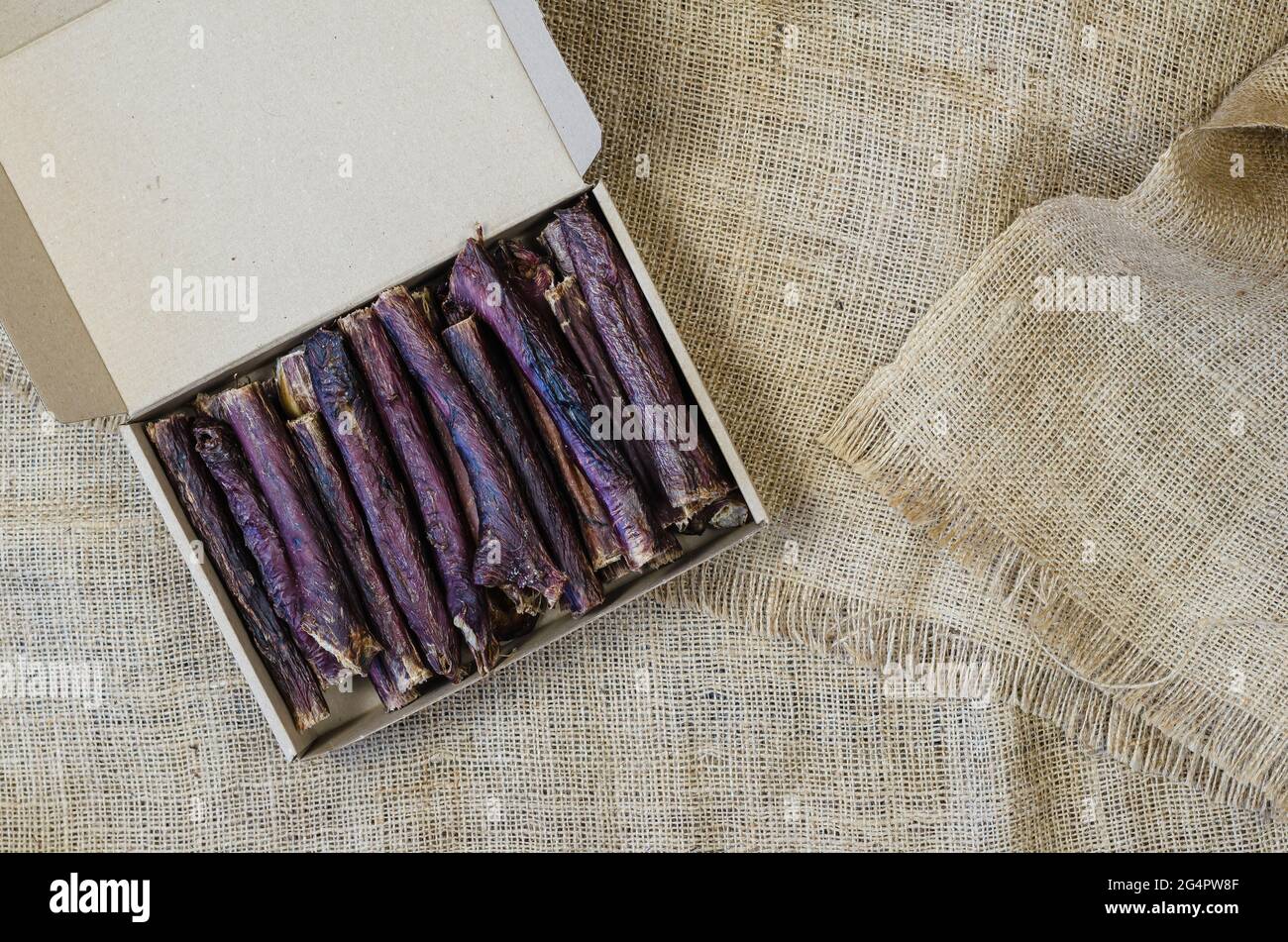 Cardboard Pet Treat Box on burlap fabric. Dried dog goodies. Delicious ...