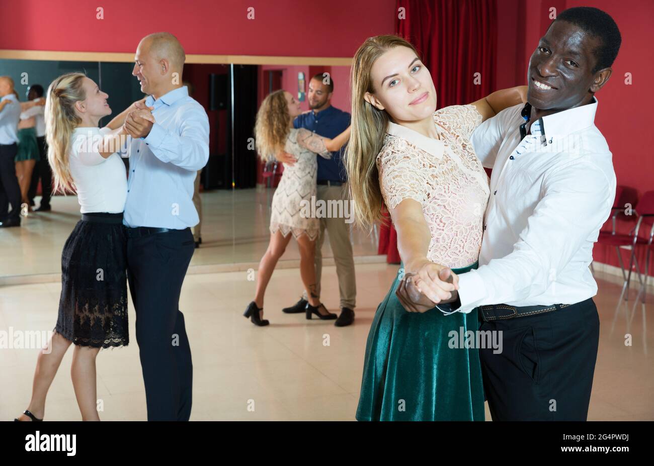 Young people learning to technique of classical dance in dancing class ...
