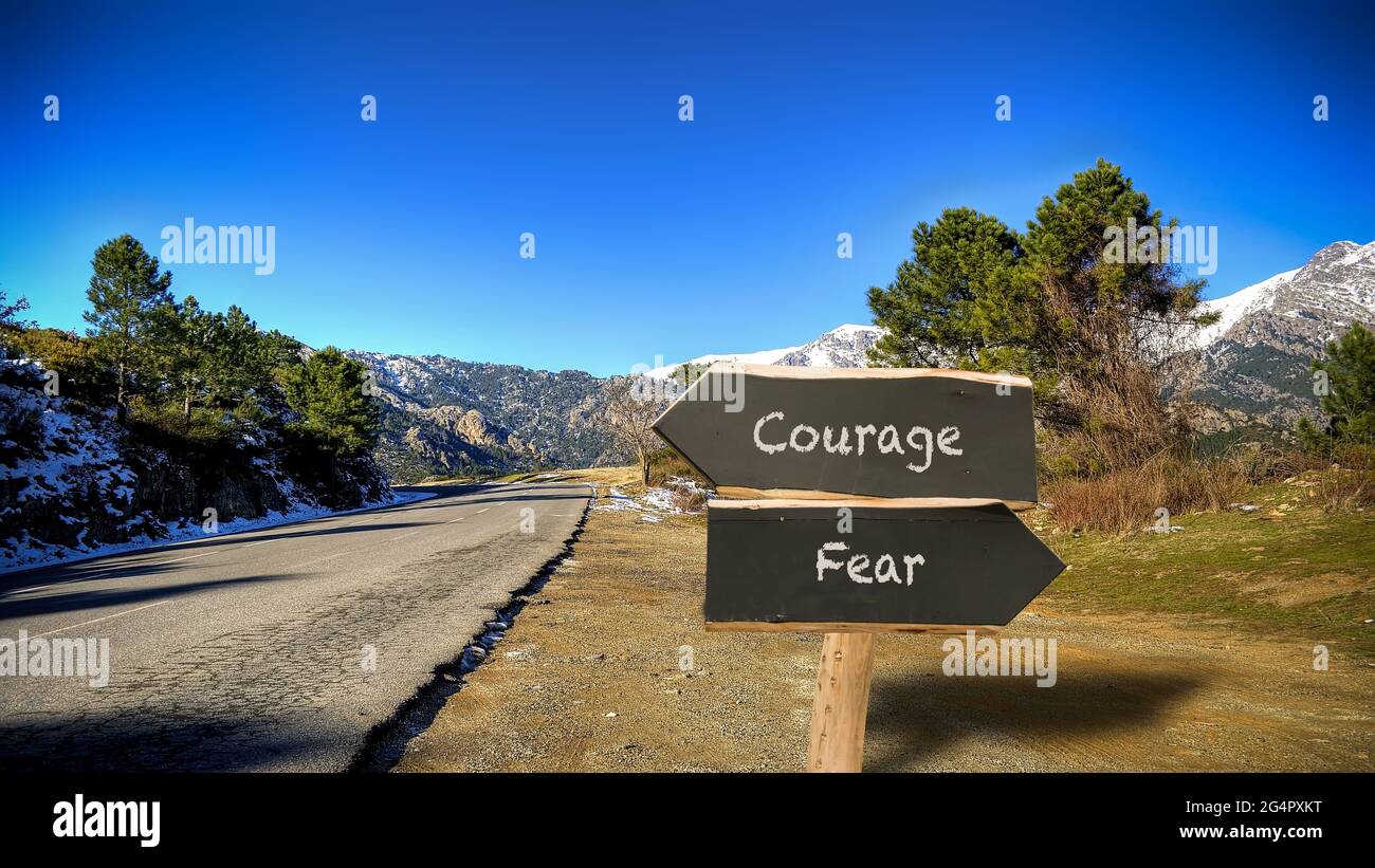 Street Sign the Direction Way to Courage versus Fear Stock Photo - Alamy