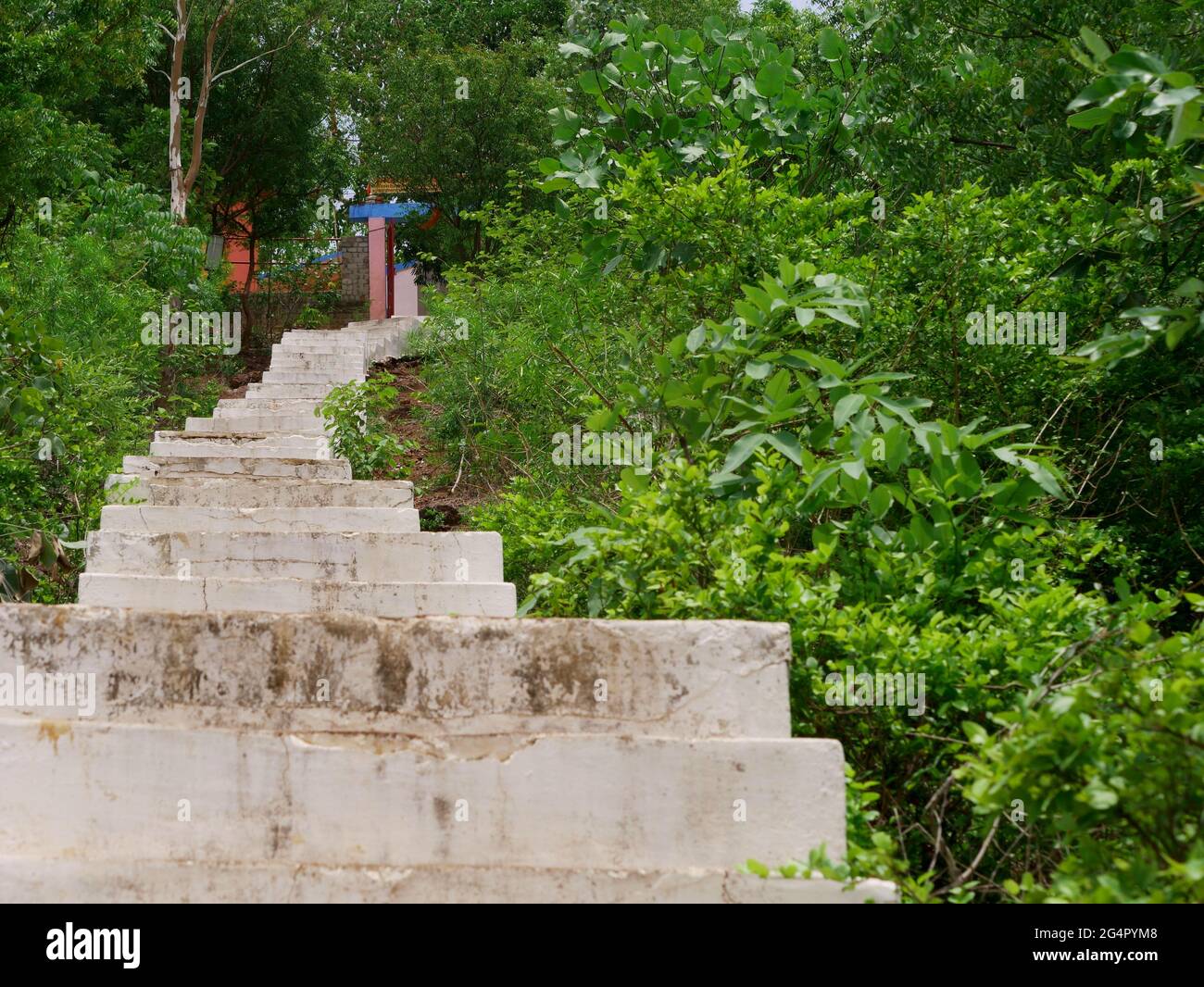 Hindu temple stairs down to up composition in natural mountain Stock ...