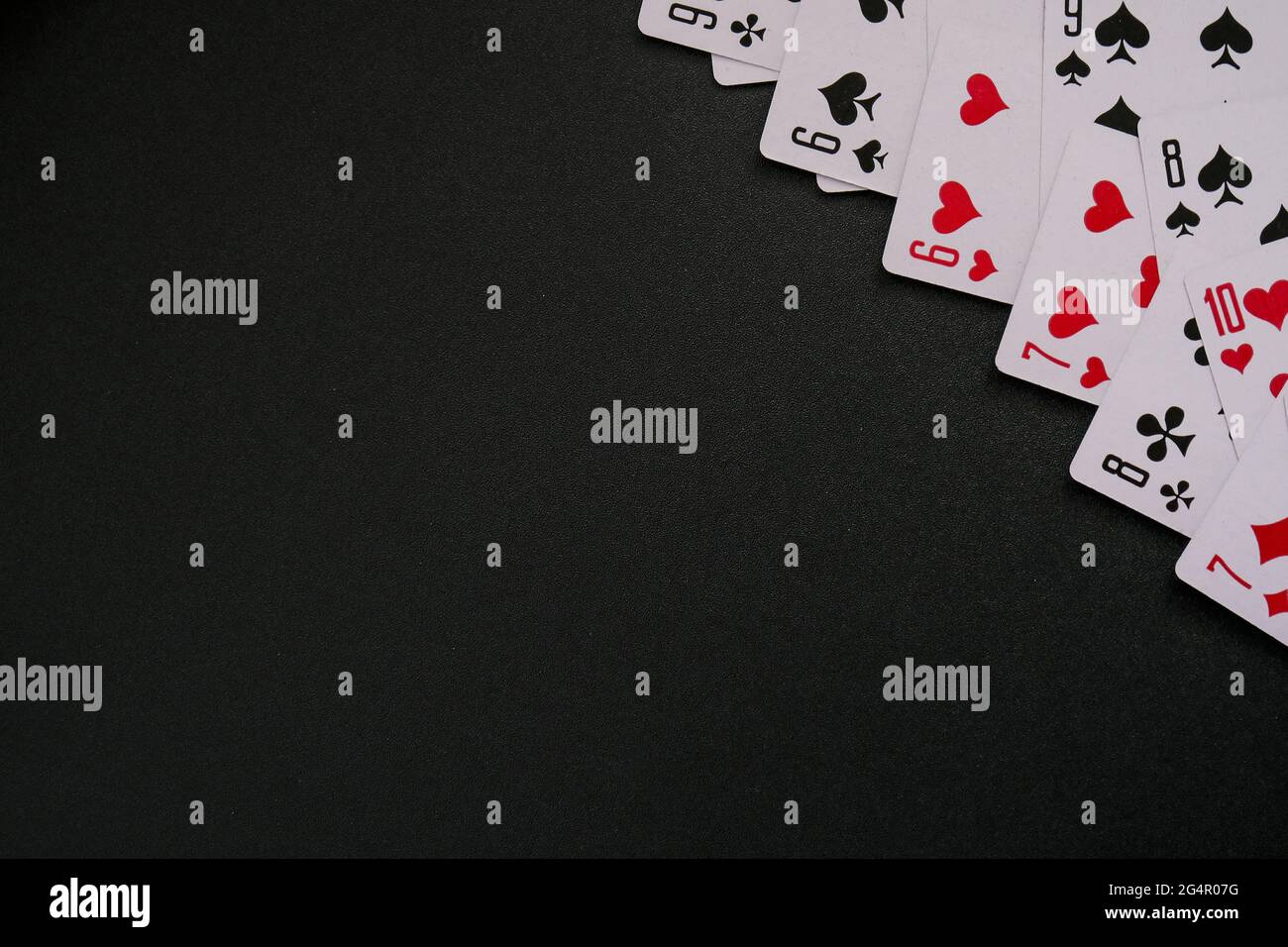 Playing cards on black background with copy space. Stay home leisure ...