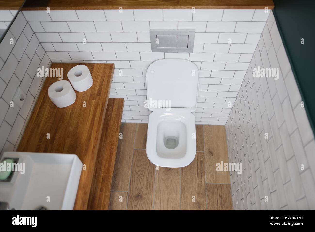 Toilet bowl stall in modern bathroom interior closeup Stock Photo - Alamy