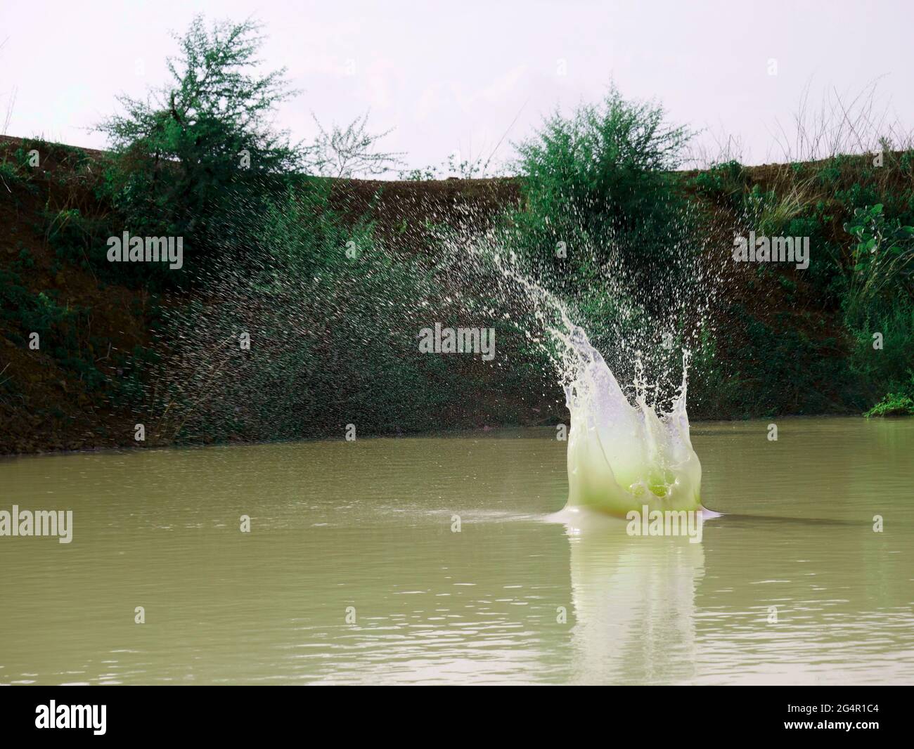 Water wave view at lake due to stone drop on force Stock Photo - Alamy