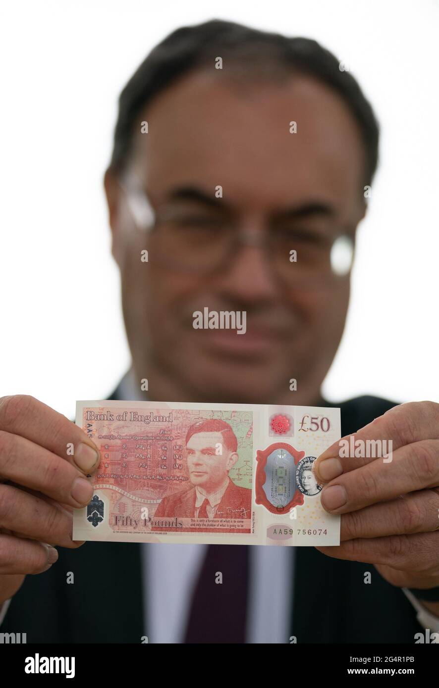 Governor of the Bank of England Andrew Bailey with the new £50 note which features Alan Turing ...