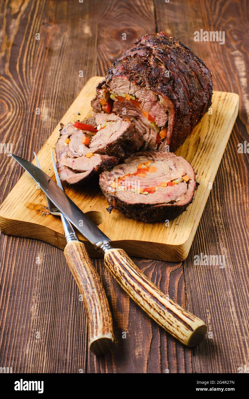 Baked beef roll with vegetables Stock Photo - Alamy