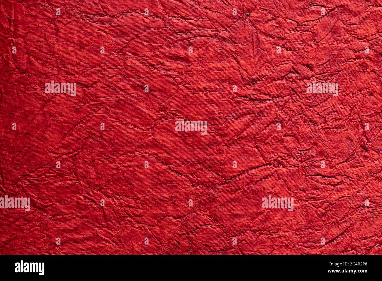 Background with red colour crushed paper Stock Photo - Alamy