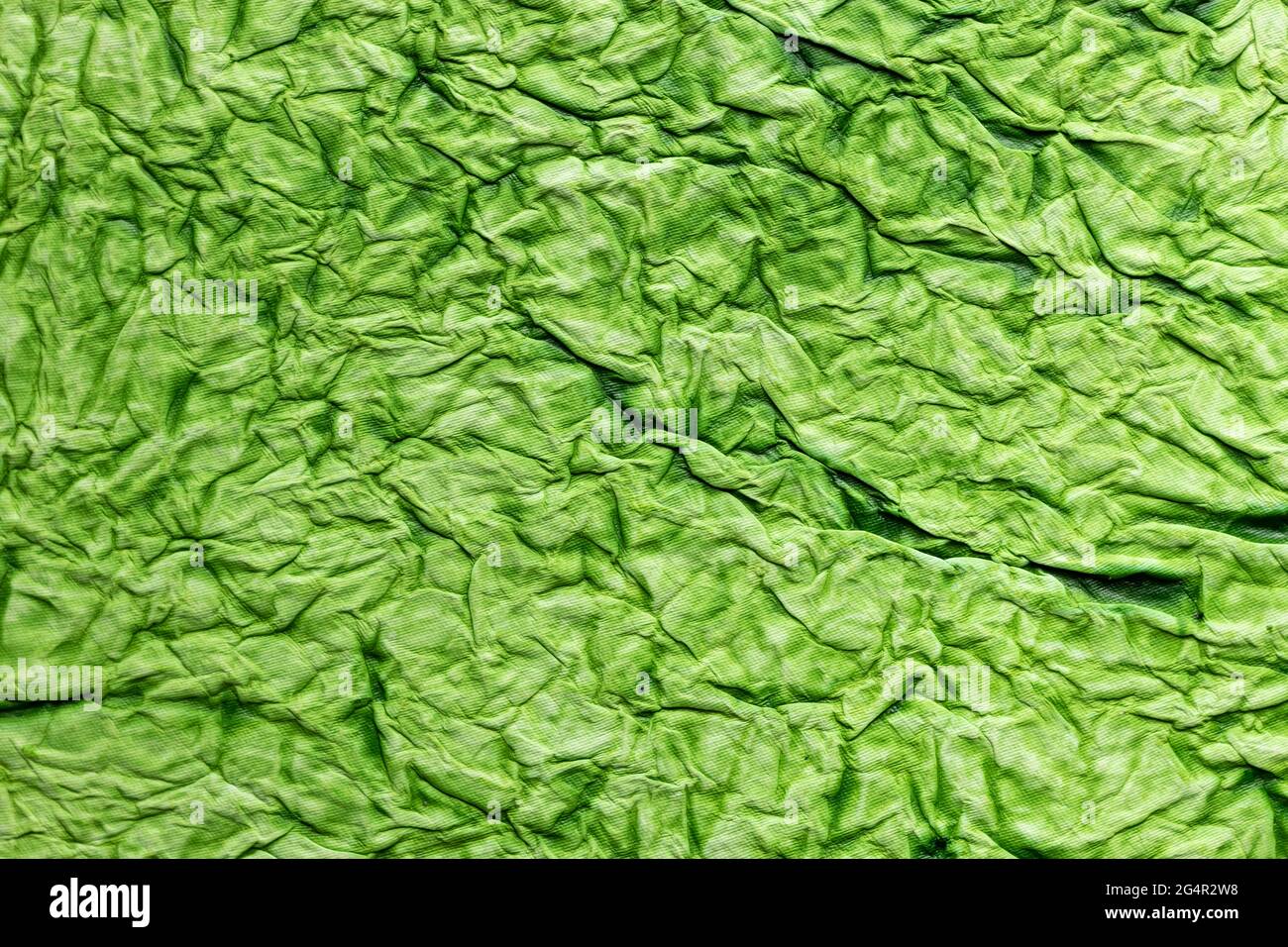 Background with green colour crushed paper Stock Photo - Alamy