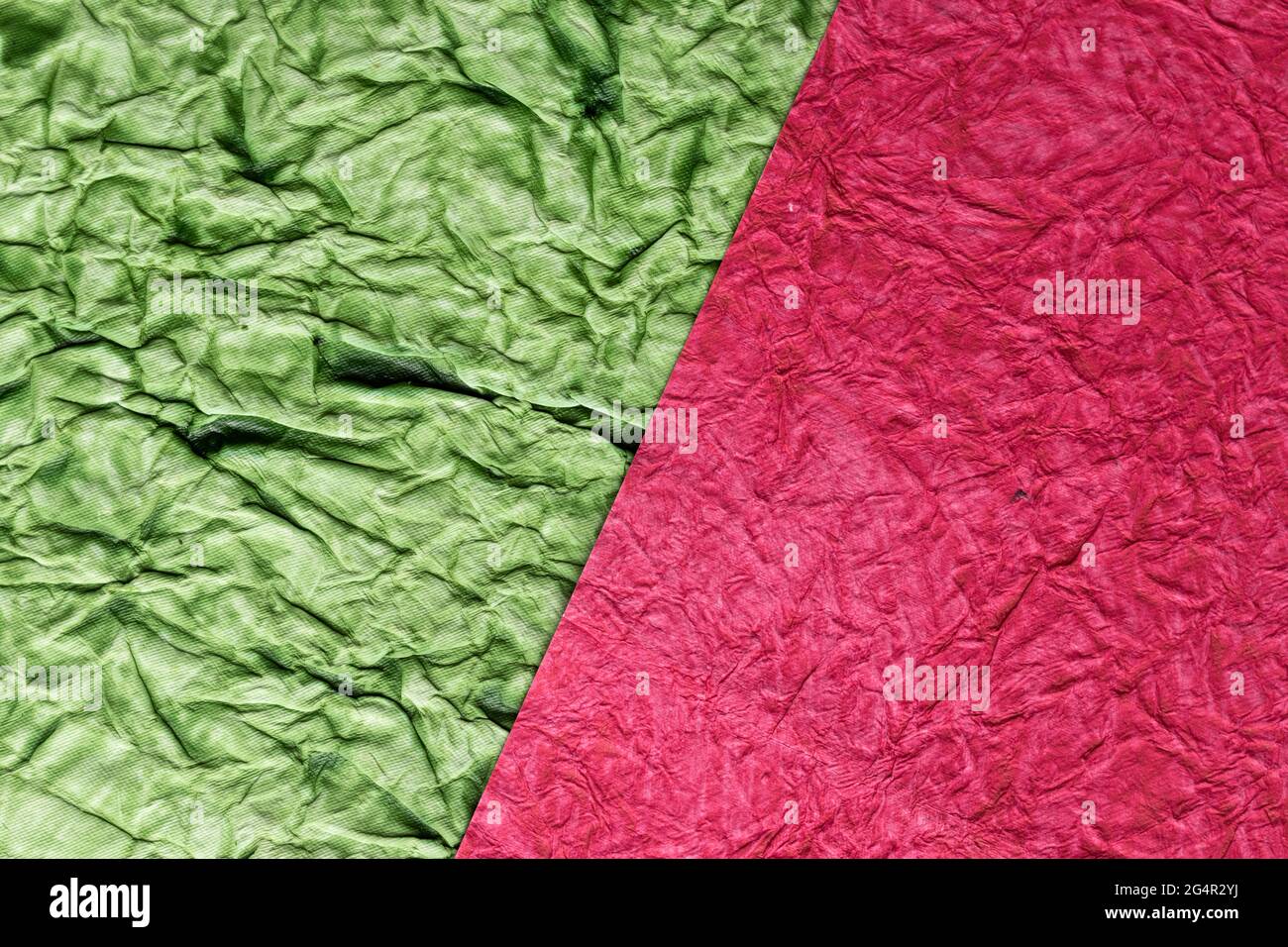 Splitted Background with green and pink crushed paper Stock Photo - Alamy