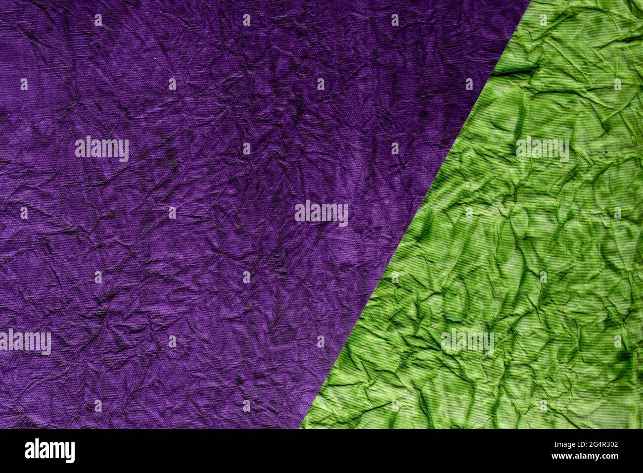 Splitted Background with violet and green crushed paper Stock Photo - Alamy