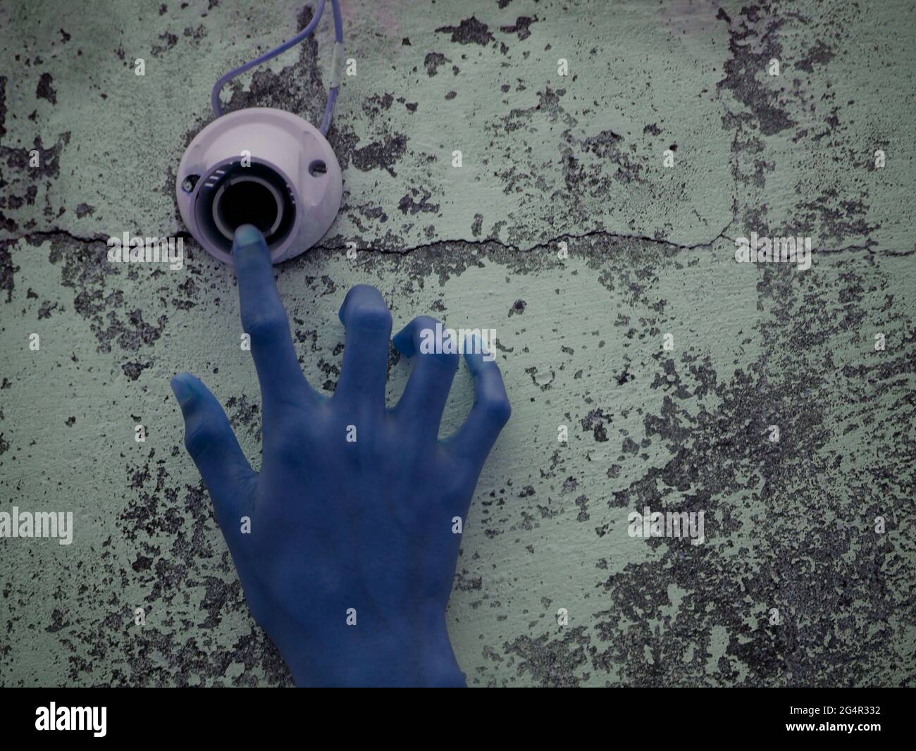 Blue hand due to electric shock concept presented on bulb holder Stock ...