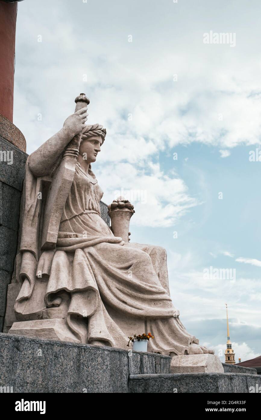 Ancient roman statue of a seated woman god close up on the background ...
