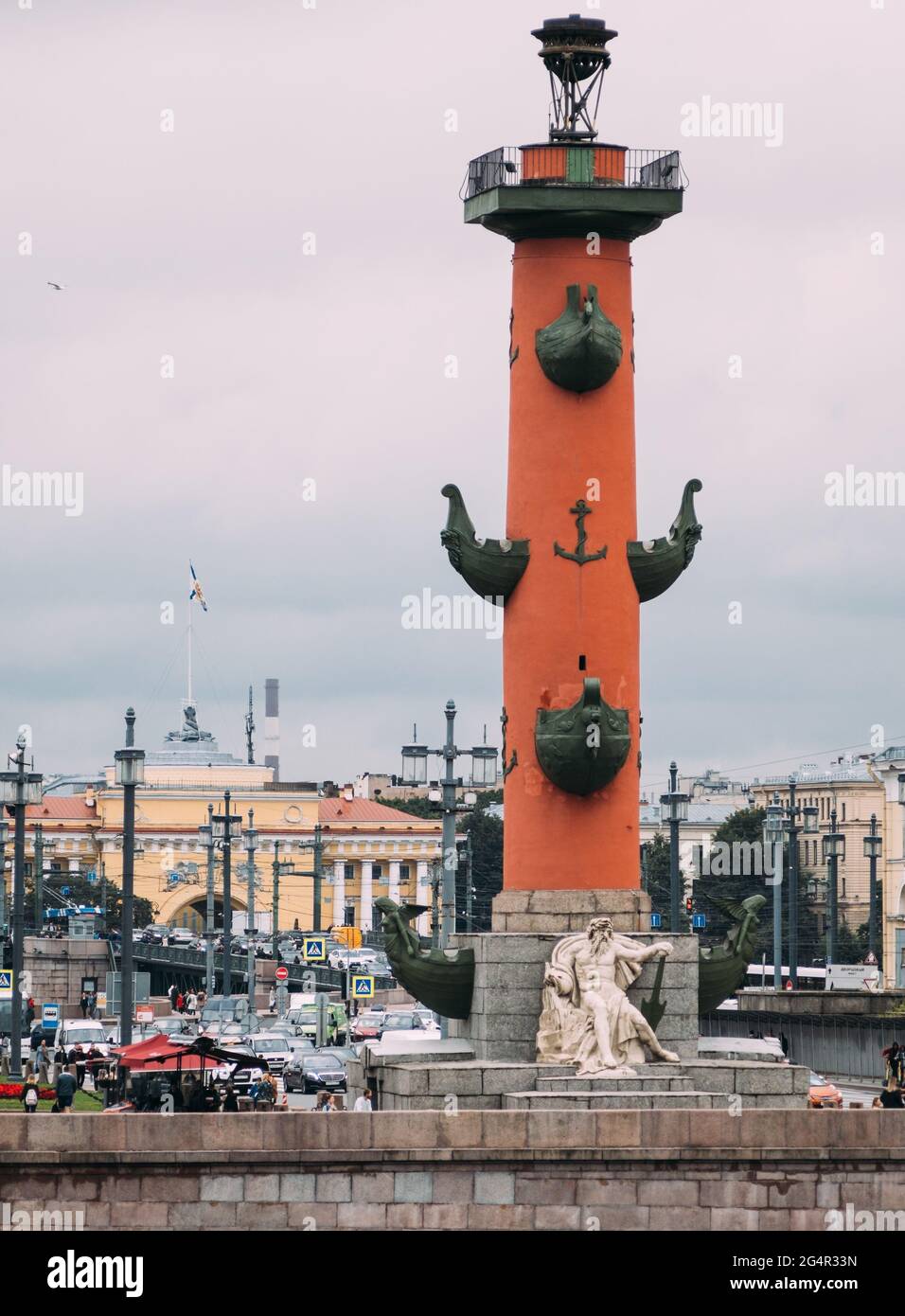 Rostral columns in the background the spire and the flag of the ...