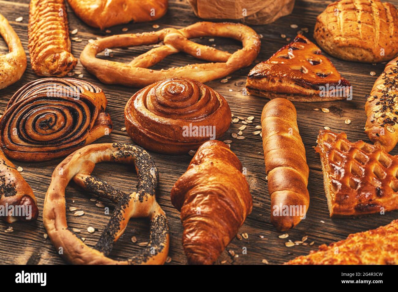 Assortment of tasty sugary bakery products in variety flavor on wooden ...