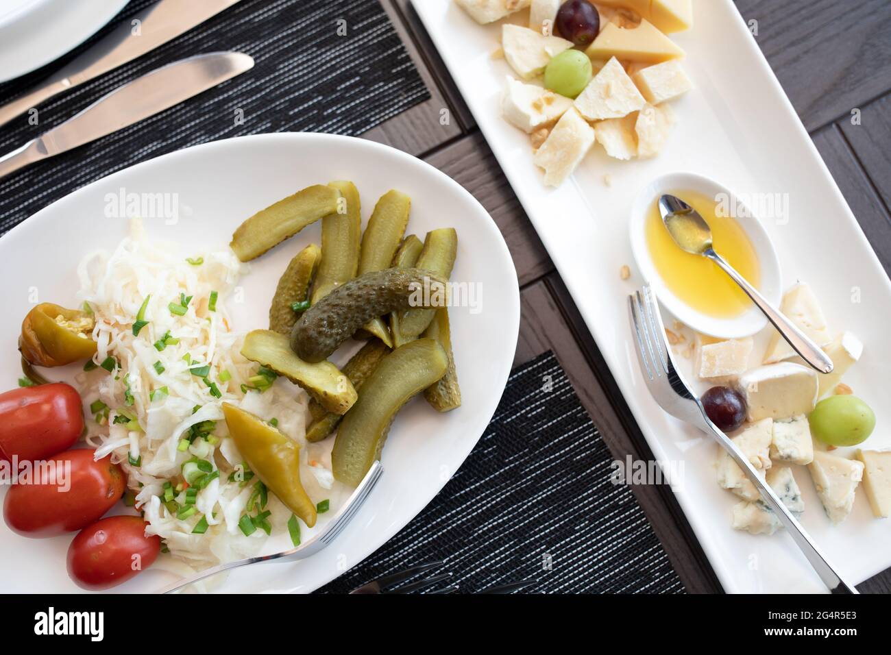Assorted snacks. cheese plate, pickles serves at the resyaurant Stock ...