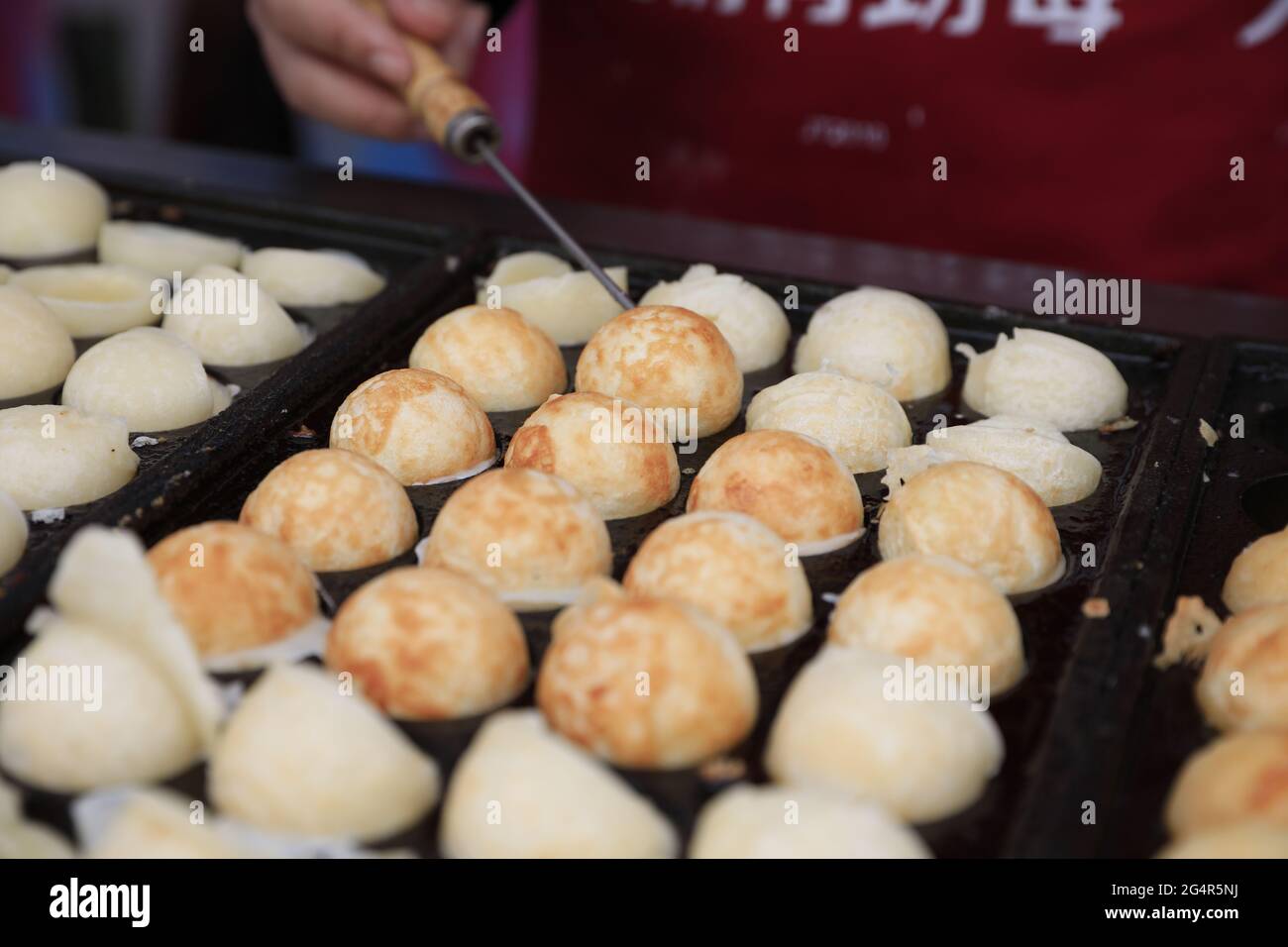 Small octopus balls Stock Photo - Alamy