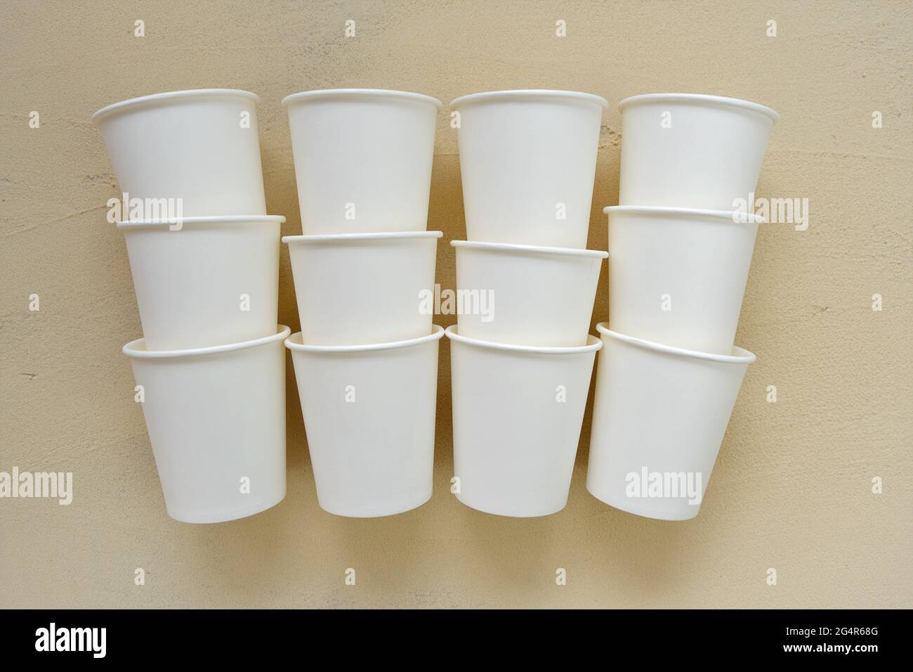 Cups made of biodegradable paper.tableware from paper. Disposable beige ...