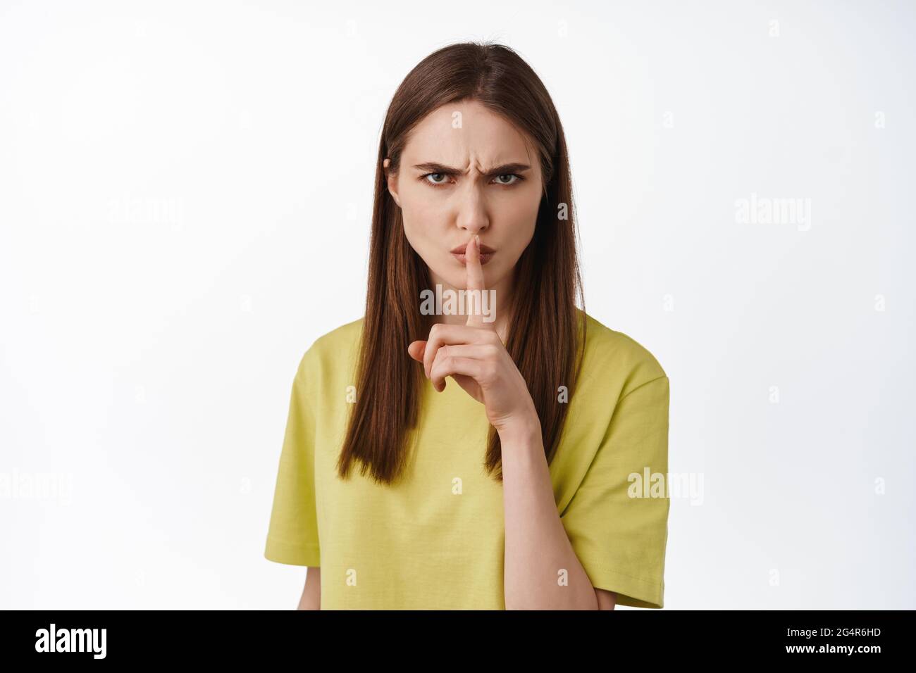 Portrait Of Angry Brunette Girl Shushing Dont Speak Keep Quiet