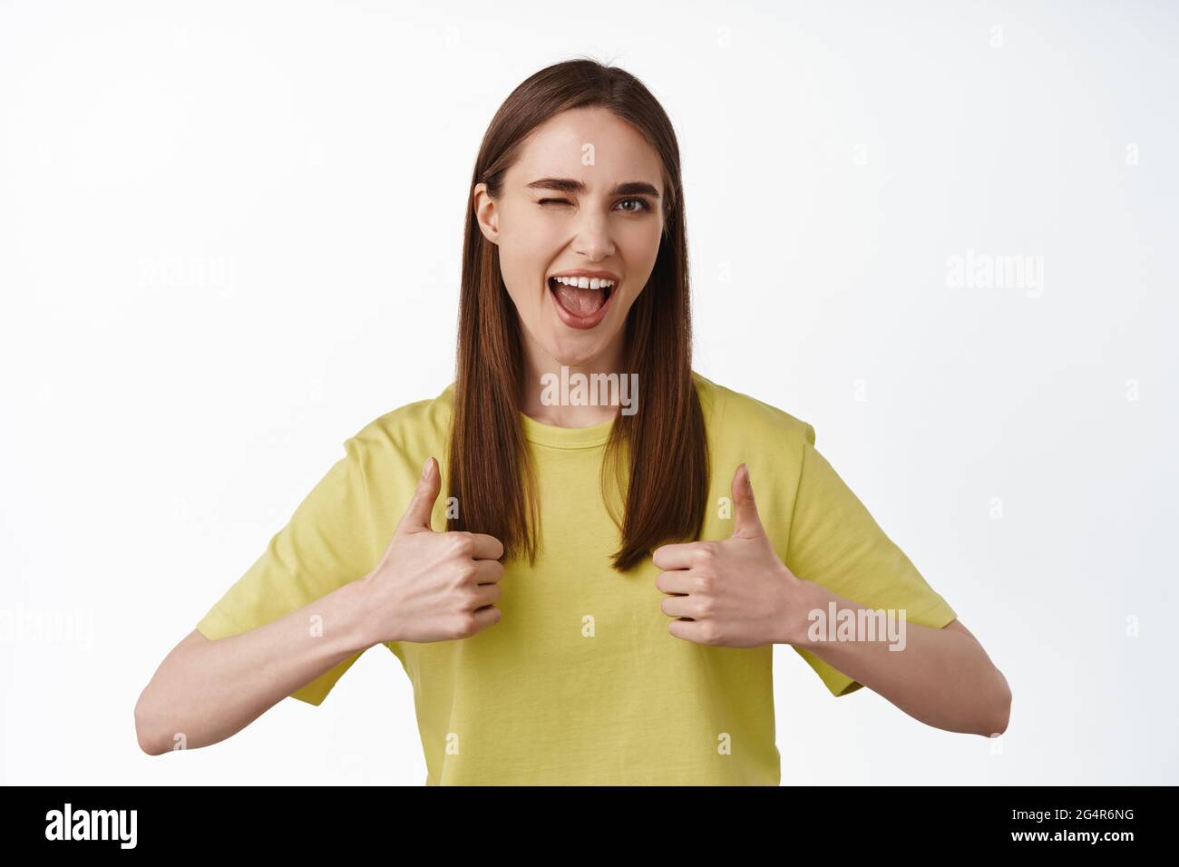 Woman winking thumbs up hi-res stock photography and images - Alamy